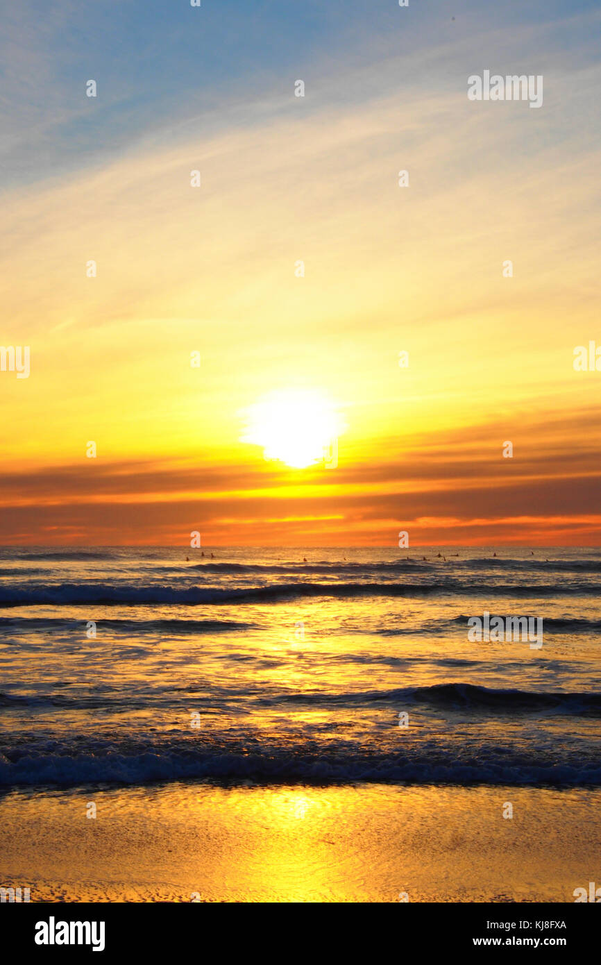 sunset at piha beach, new zealand Stock Photo - Alamy