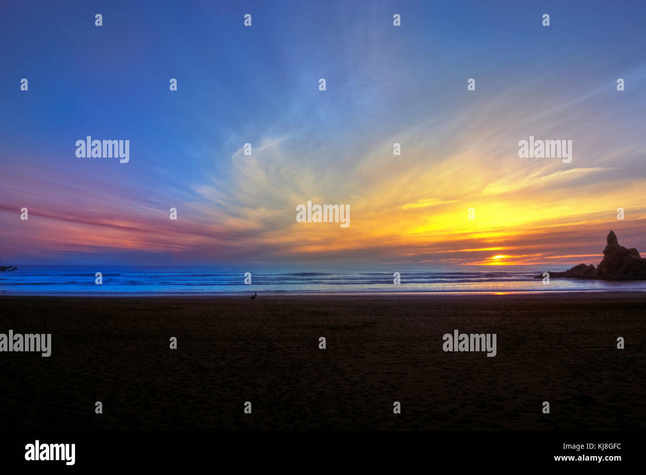 sunset at piha beach, new zealand Stock Photo - Alamy