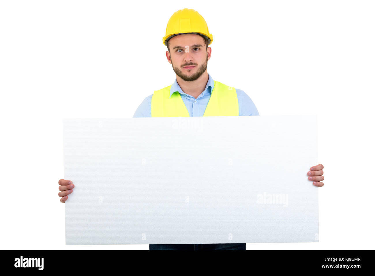 Happy male engineer holding an advertisement blank banner. Isolated on ...