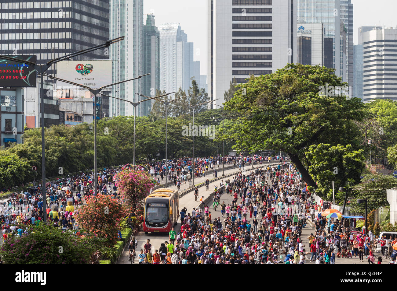 JAKARTA, INDONESIA - OCTOBER 15, 2017: A huge crowd attends the car free day along Sudirman ...