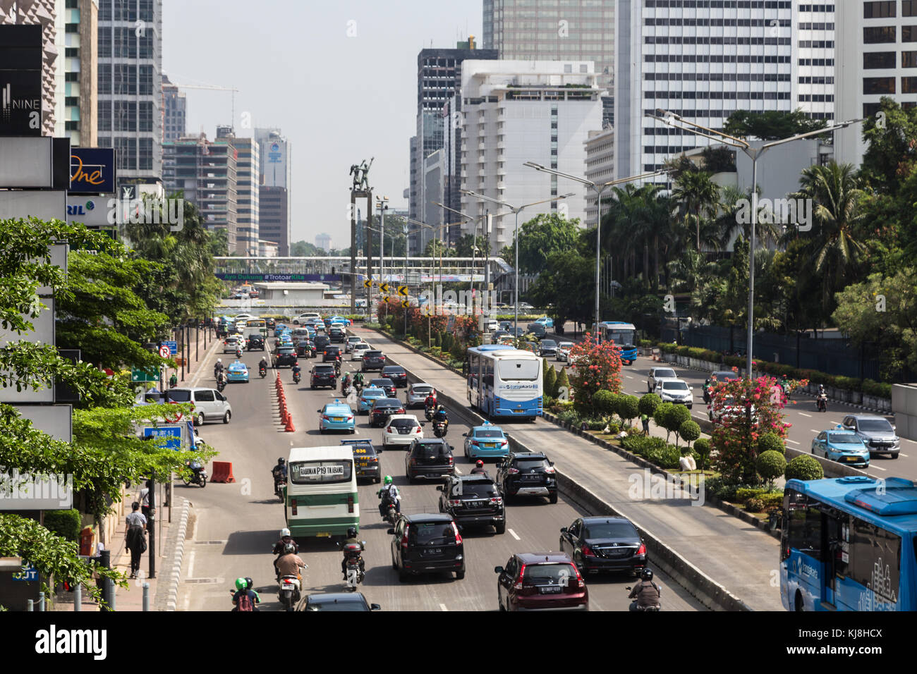 JAKARTA, INDONESIA - OCTOBER 13, 2017: Traffic goes along Sudirman ...