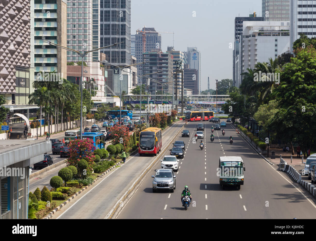 JAKARTA, INDONESIA - OCTOBER 13, 2017: Traffic goes along Sudirman ...