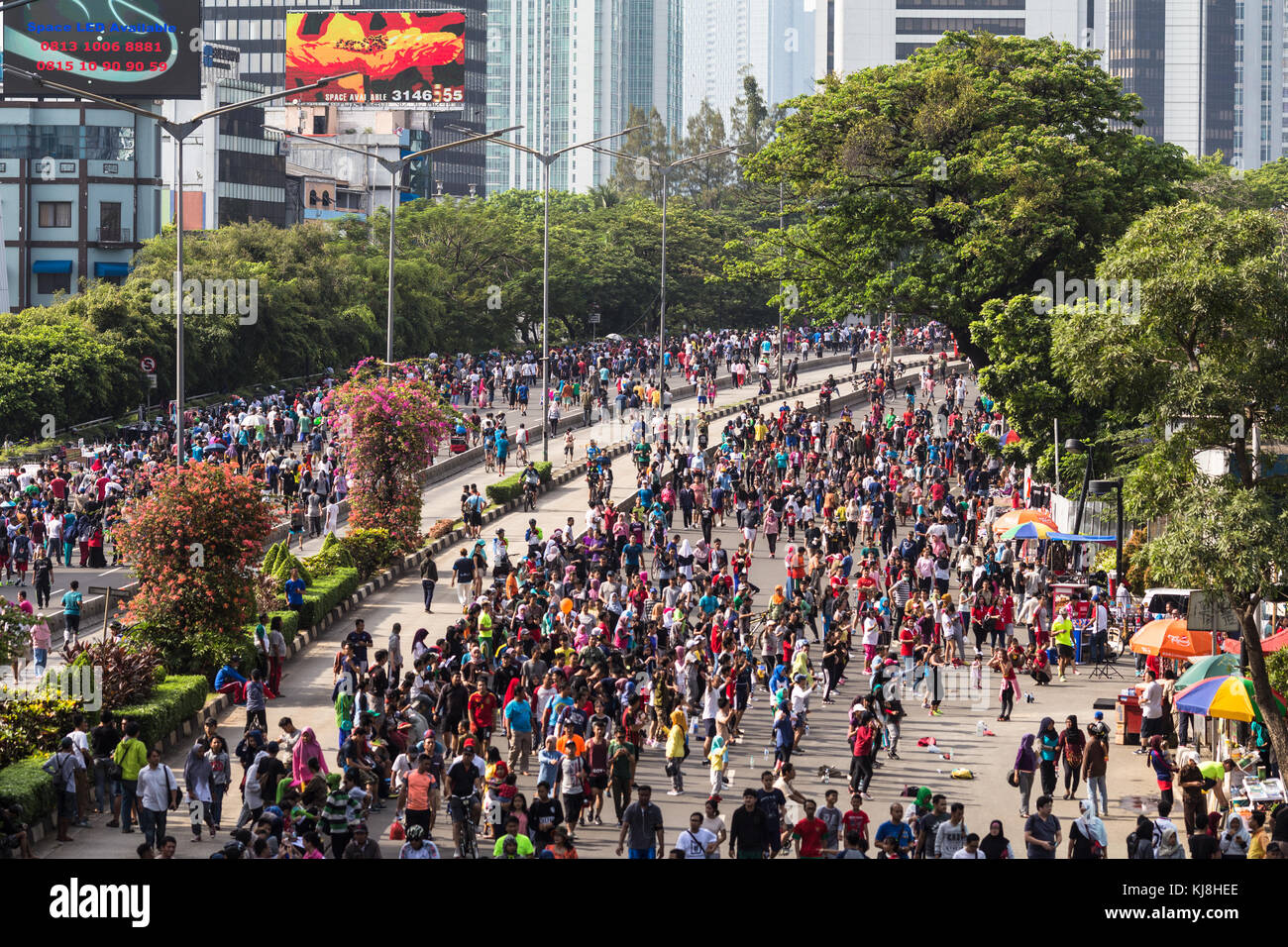 JAKARTA, INDONESIA - OCTOBER 15, 2017: A huge crowd attends the car free day along Sudirman ...