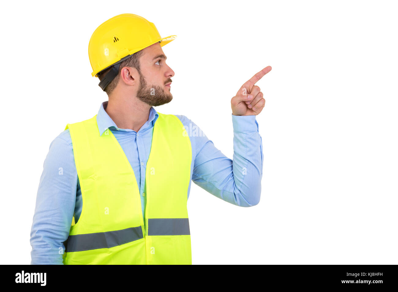 Happy professional engineer pointing to something isolated on white ...