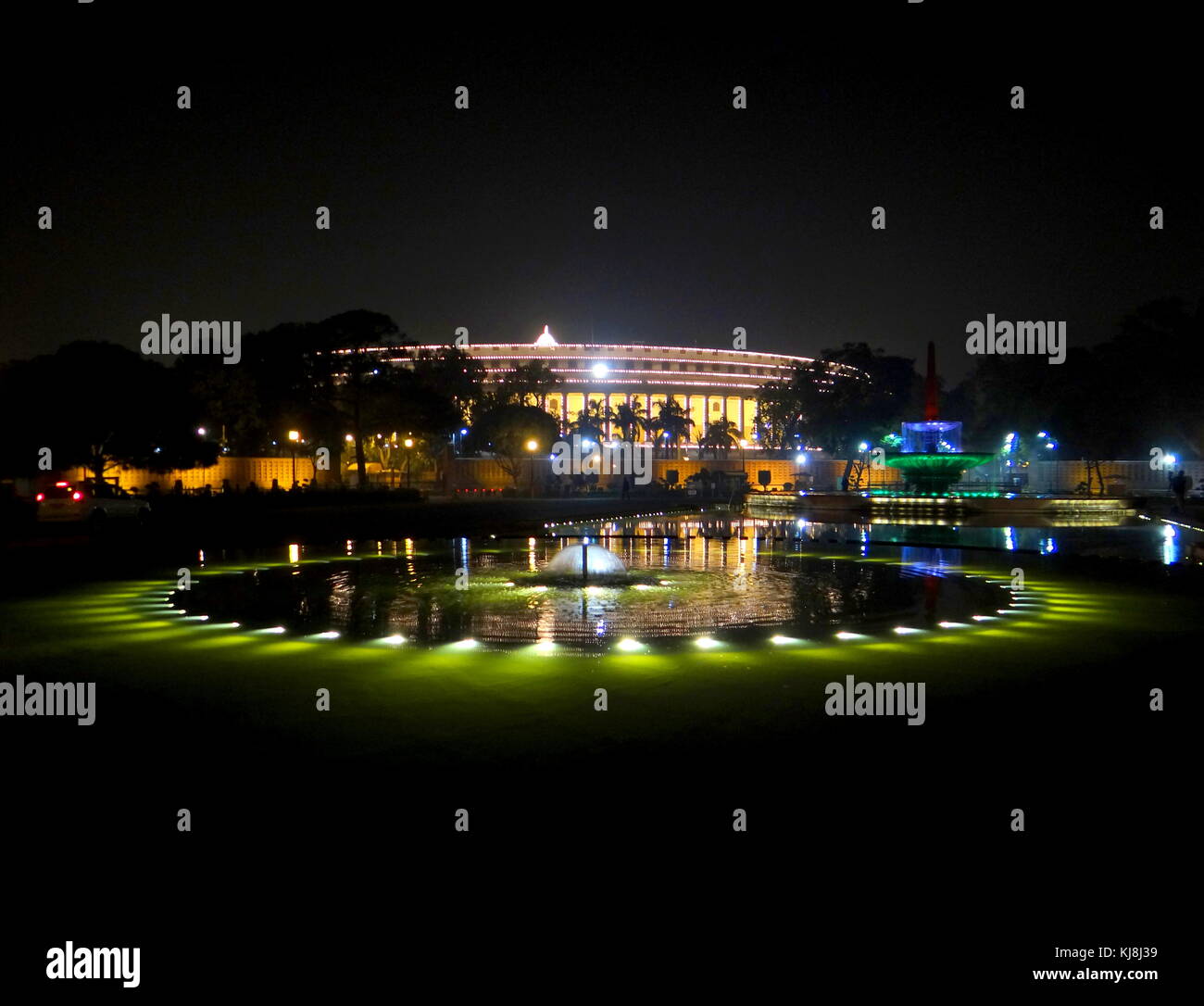 A view of the Parliament of India illuminated in lights during night ...