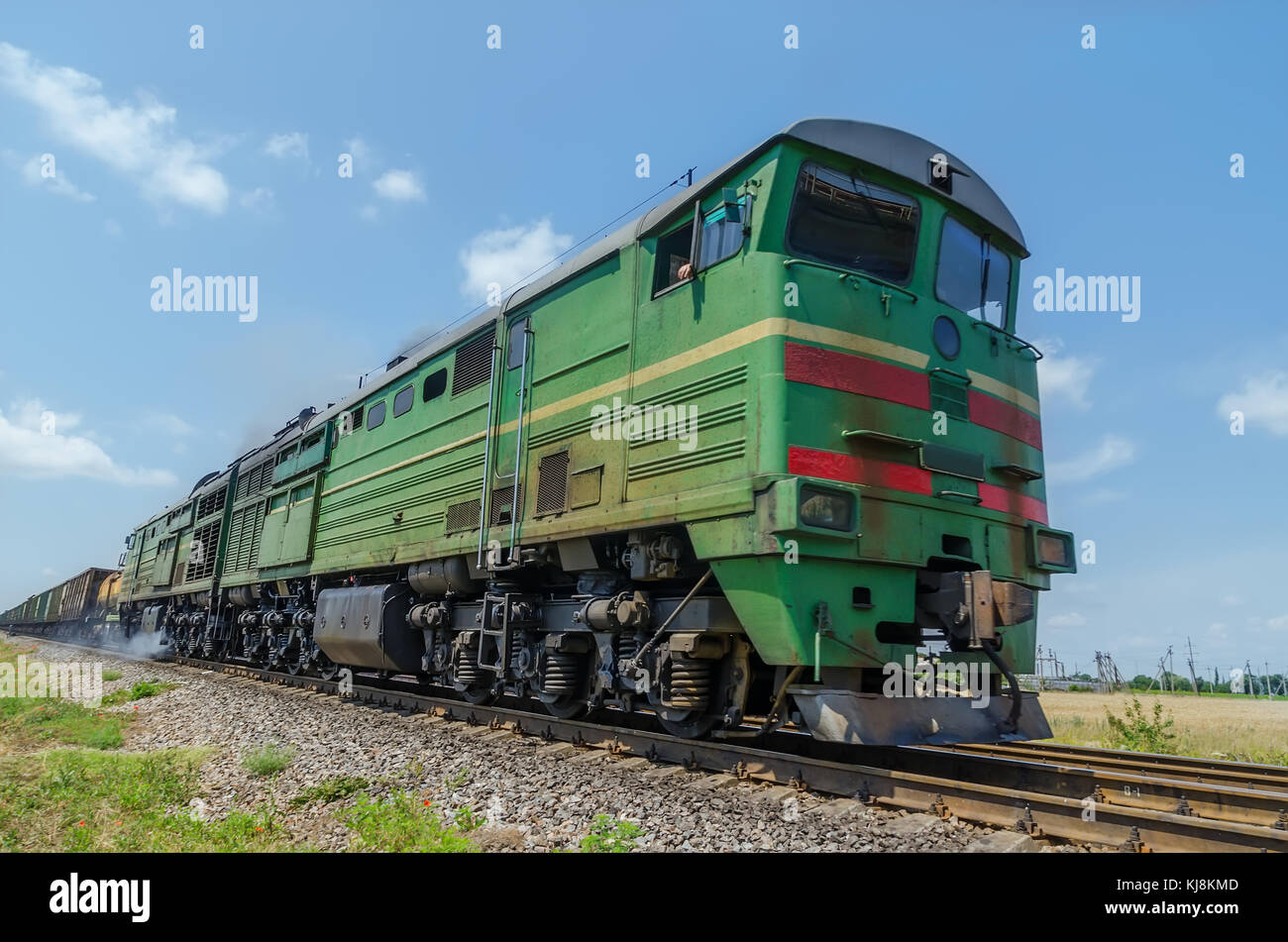 green locomotive in motion on the railway Stock Photo - Alamy