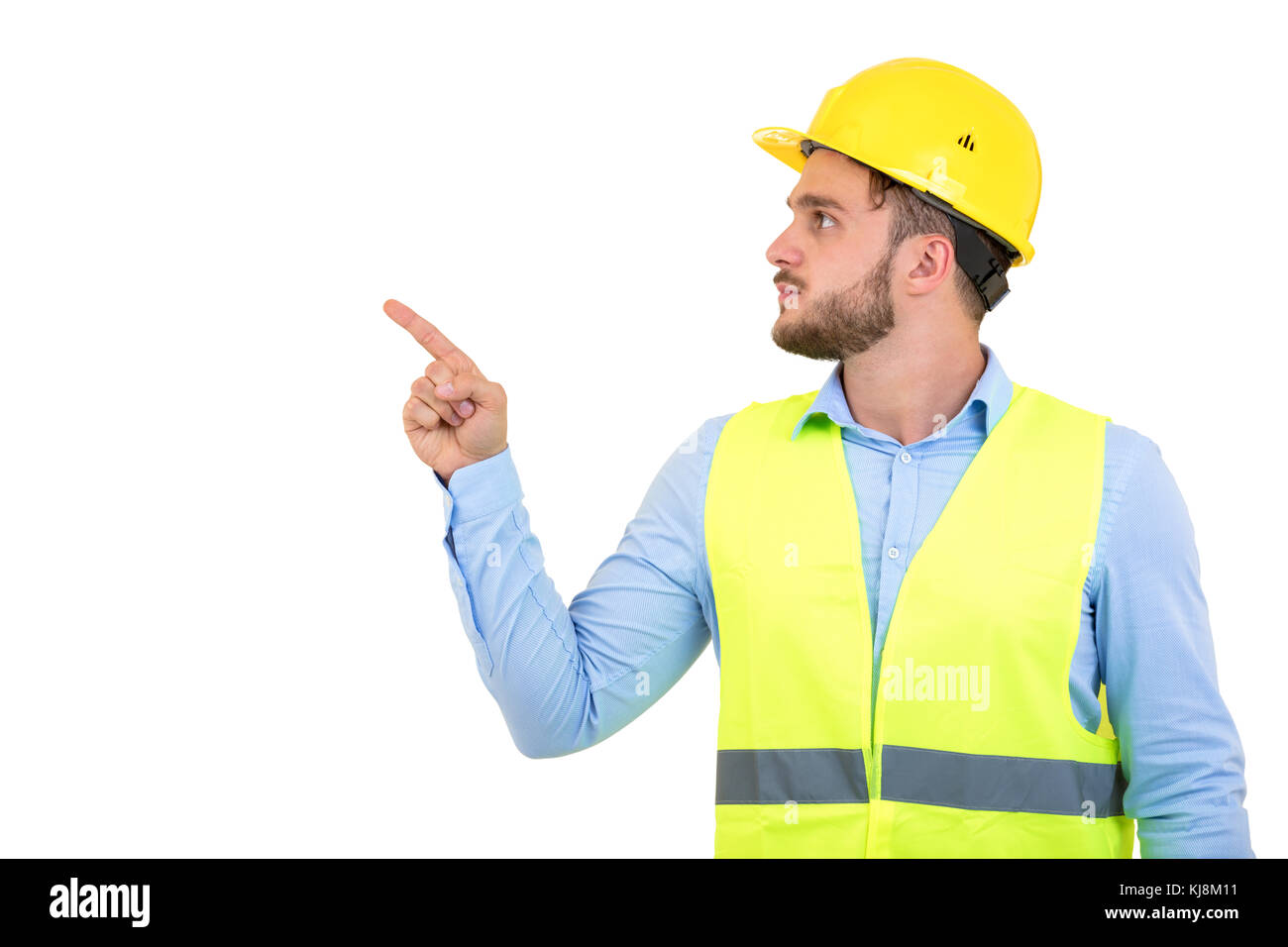 Happy professional engineer pointing to something isolated on white ...