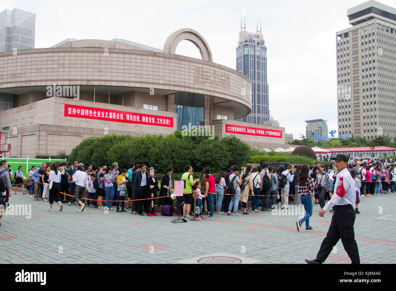 People line up outside the Shanghai Museum near People's Square Park in ...
