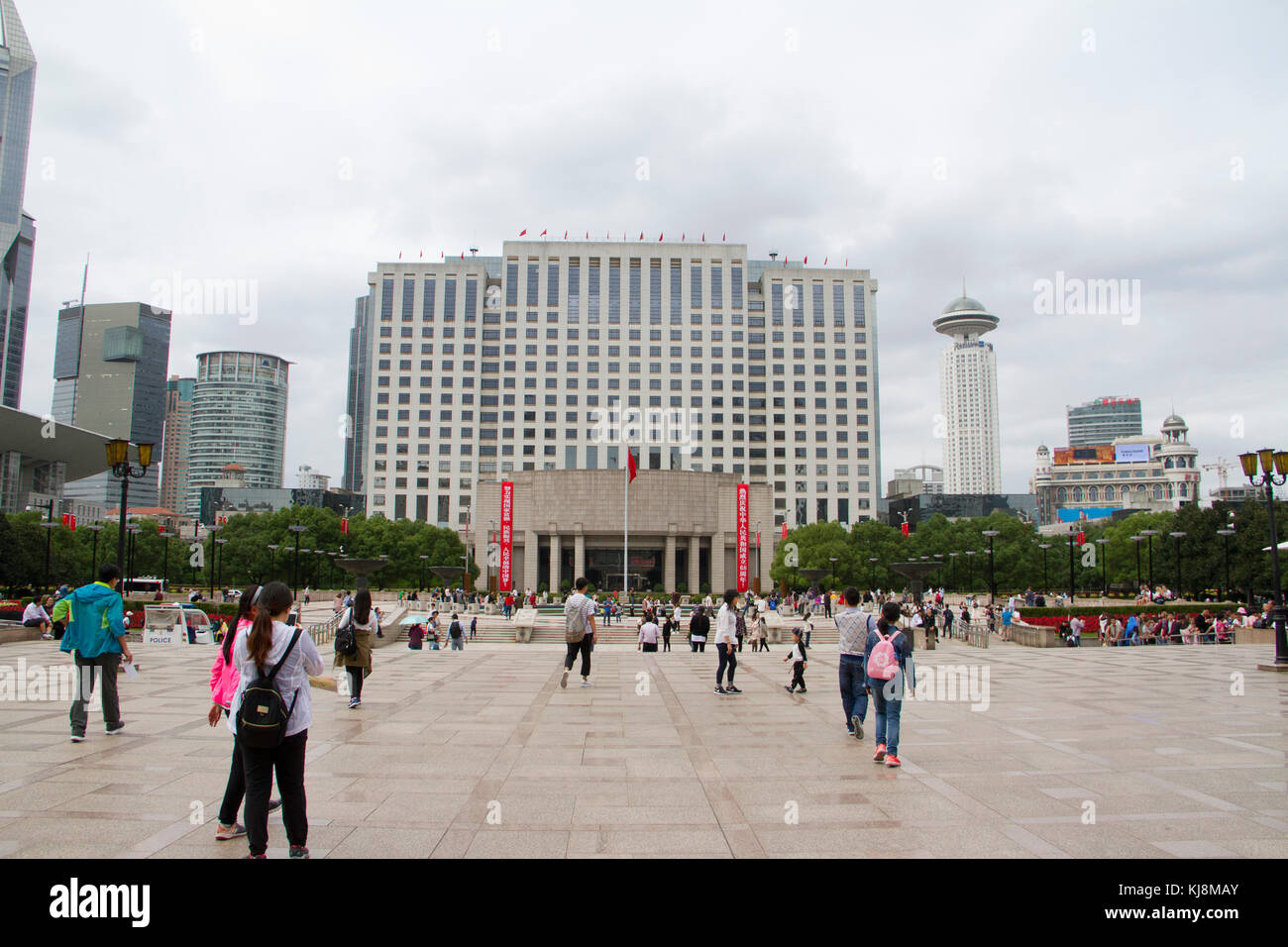 People walk through People's Square Park in central Shanghai, China ...