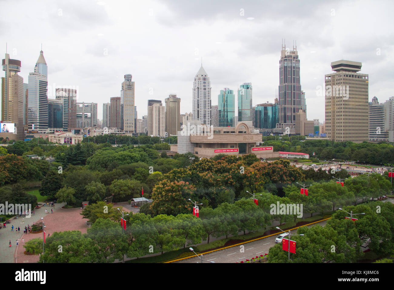 People walk through People's Square Park in central Shanghai, China ...