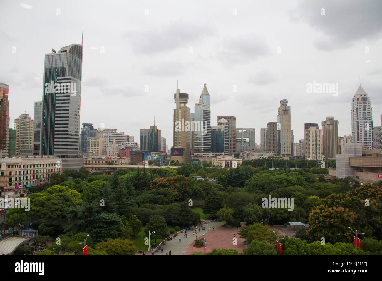 People walk through People's Square Park in central Shanghai, China ...