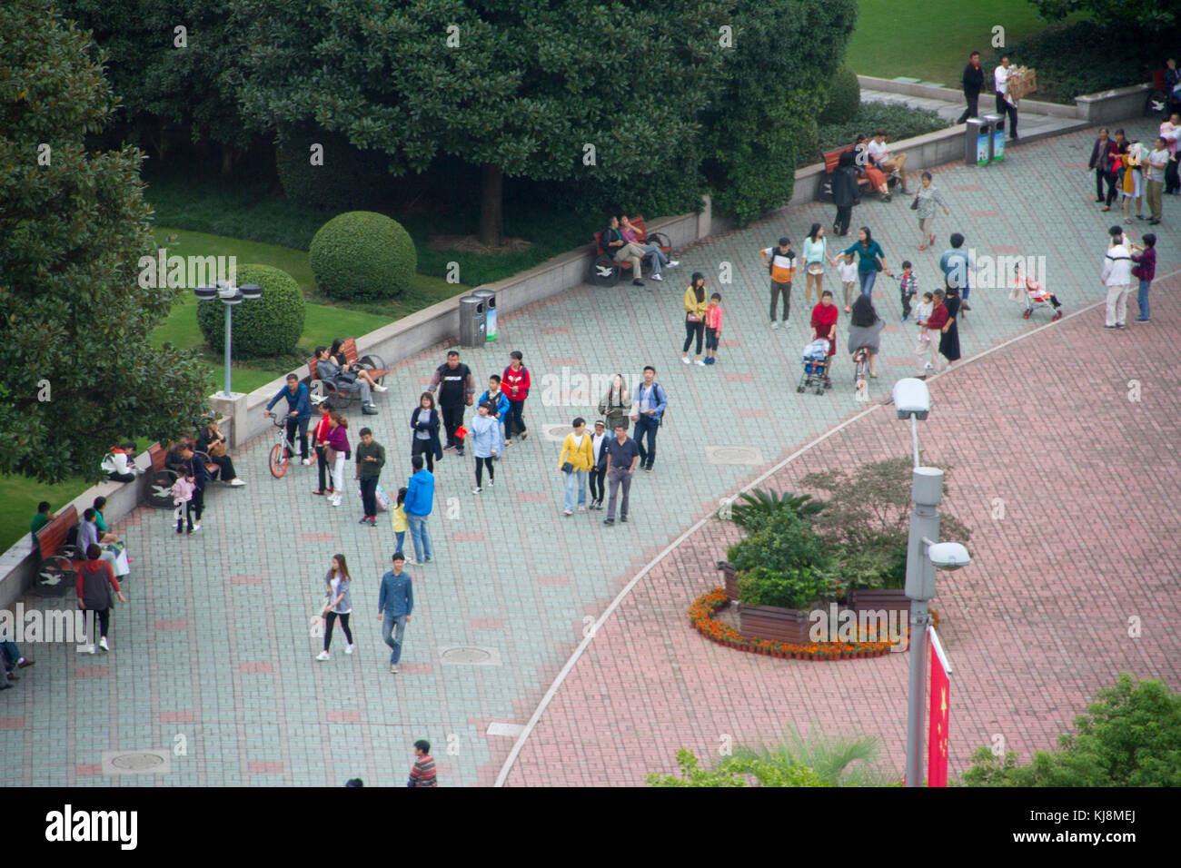 People walk through People's Square Park in central Shanghai, China ...