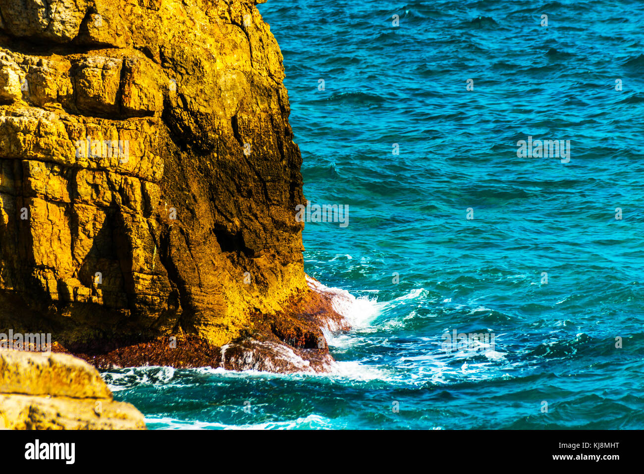 high cliff above the sea, summer sea background, many splashing waves ...