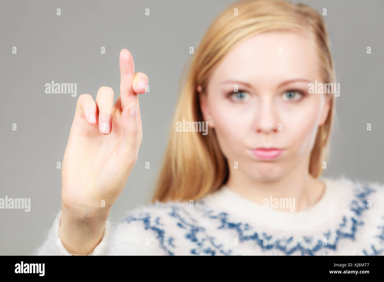 Gestures and signs concept. Teenage blonde woman making promise gesture ...