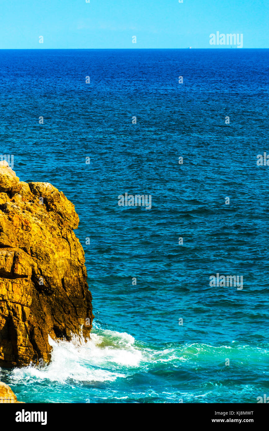 high cliff above the sea, summer sea background, many splashing waves ...