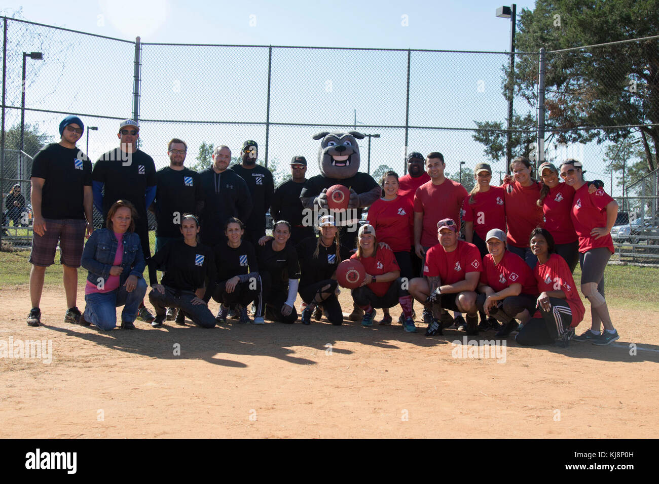 Sgt. Rocky, 3rd Infantry Division's mascot, poses with spouses from 3rd ...