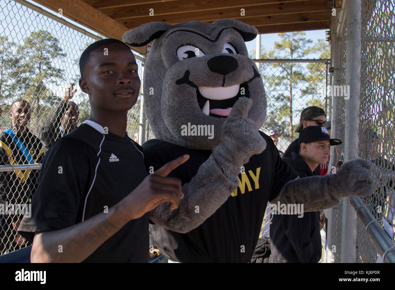 Sgt. Rocky, 3rd Infantry Division's mascot, poses in the dugout with ...