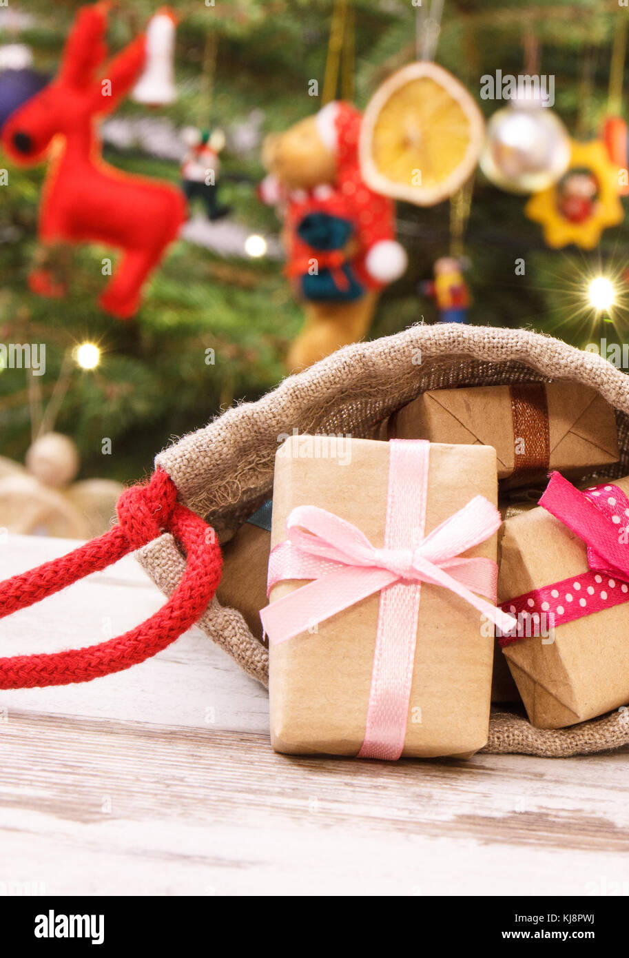 Heap of gifts with ribbons in jute bag for Christmas on background of ...
