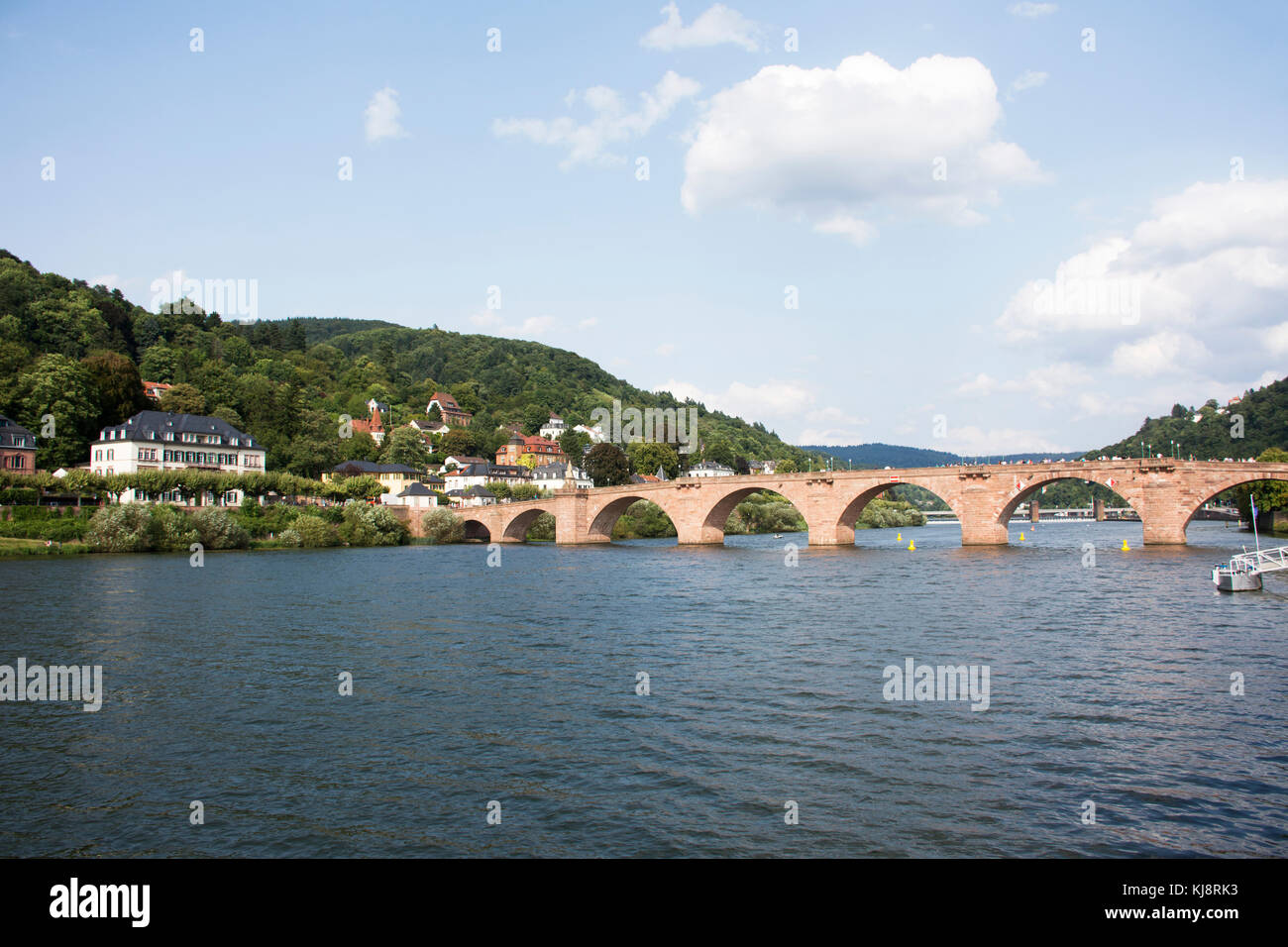 German and foreigner travelers walking and visit on Karl Theodor Bridge ...