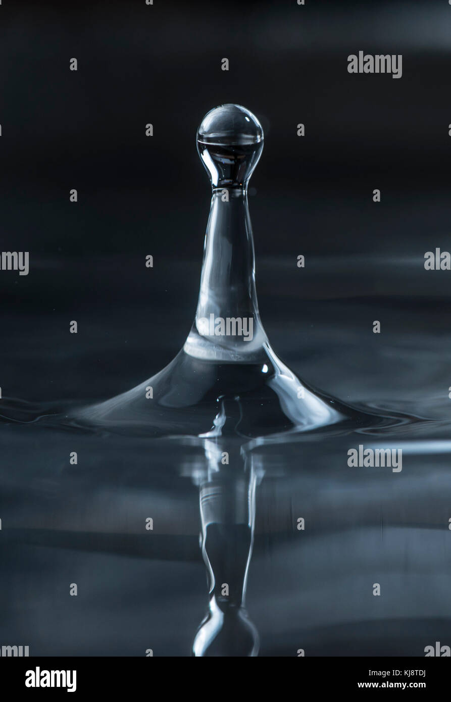 Water drop. Water splash in dark Stock Photo - Alamy