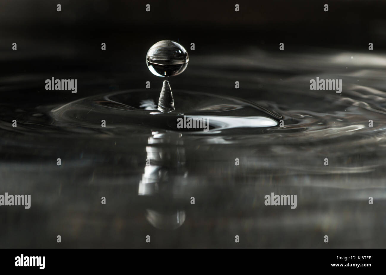 Water drop. Water splash in dark Stock Photo - Alamy