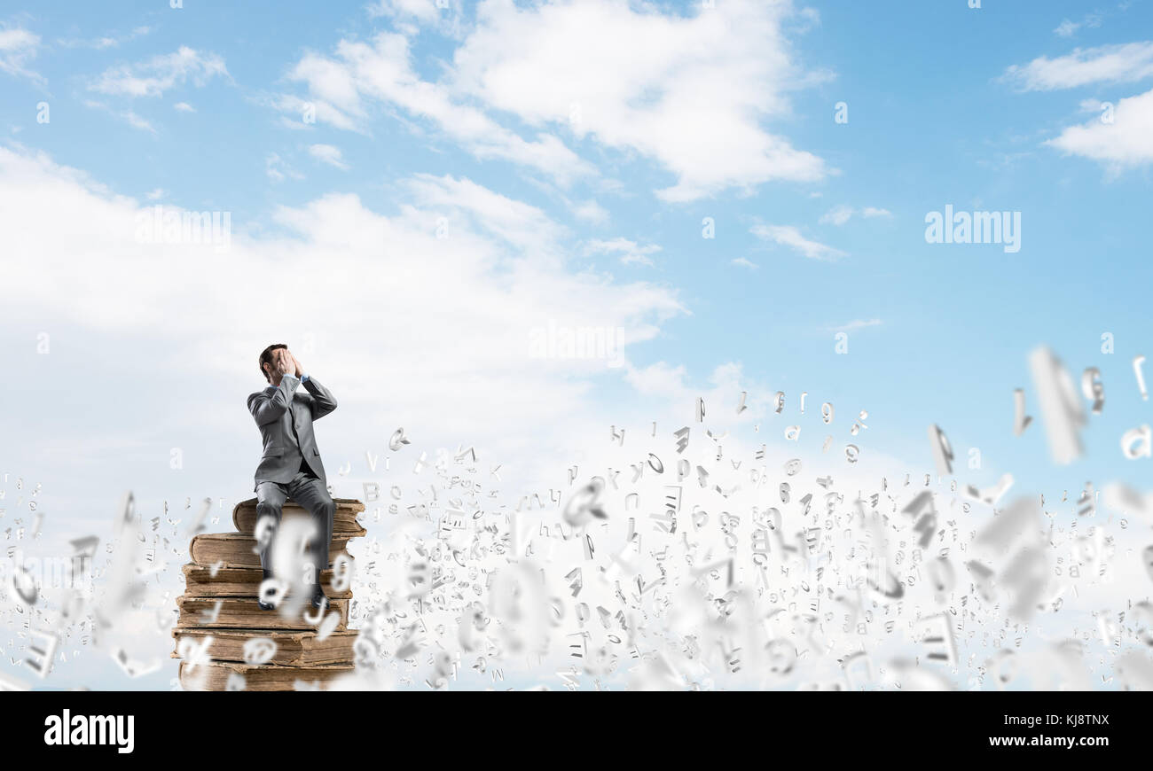 Young man floating in sky and do not want to see anything Stock Photo ...