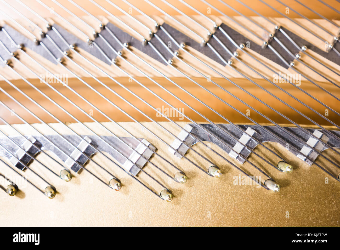 Tightly wound steel cables or strings inside grand piano Stock Photo ...