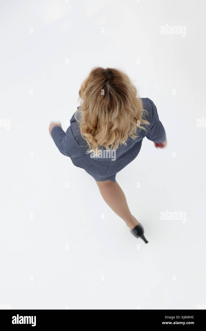 view from the top. business woman stepping forward Stock Photo - Alamy
