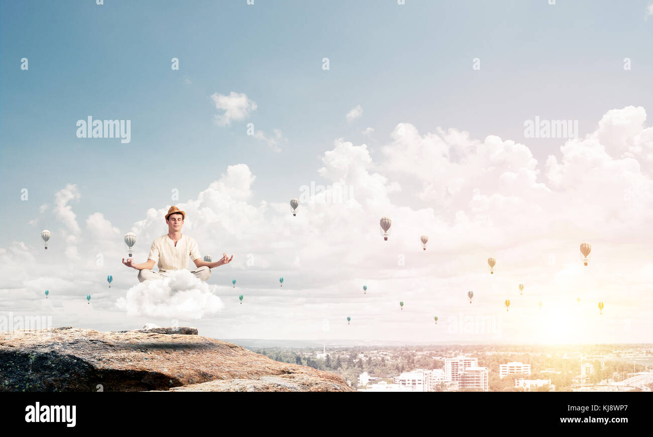 Young man keeping mind conscious Stock Photo - Alamy