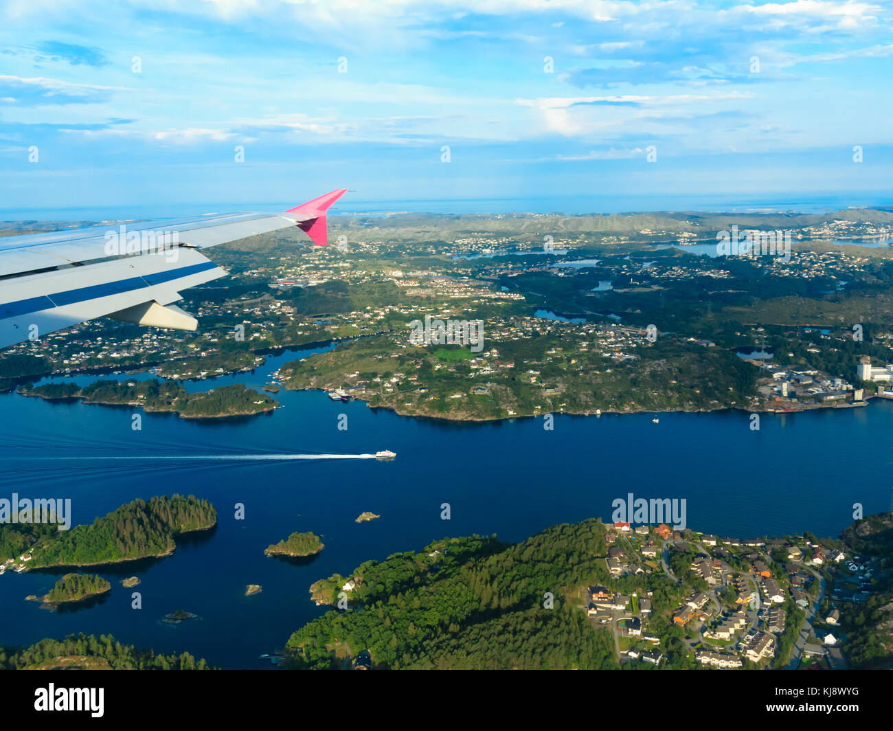 Birds eye. View from window of plane airplane flying over fjords Norway ...