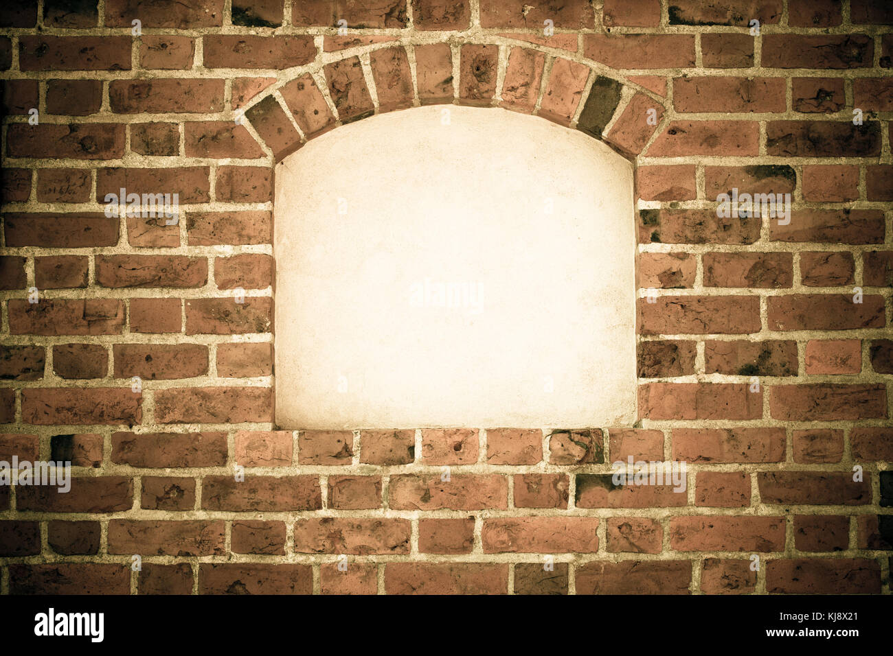 Old stone arch arc niche with space for text frame in brick wall ...
