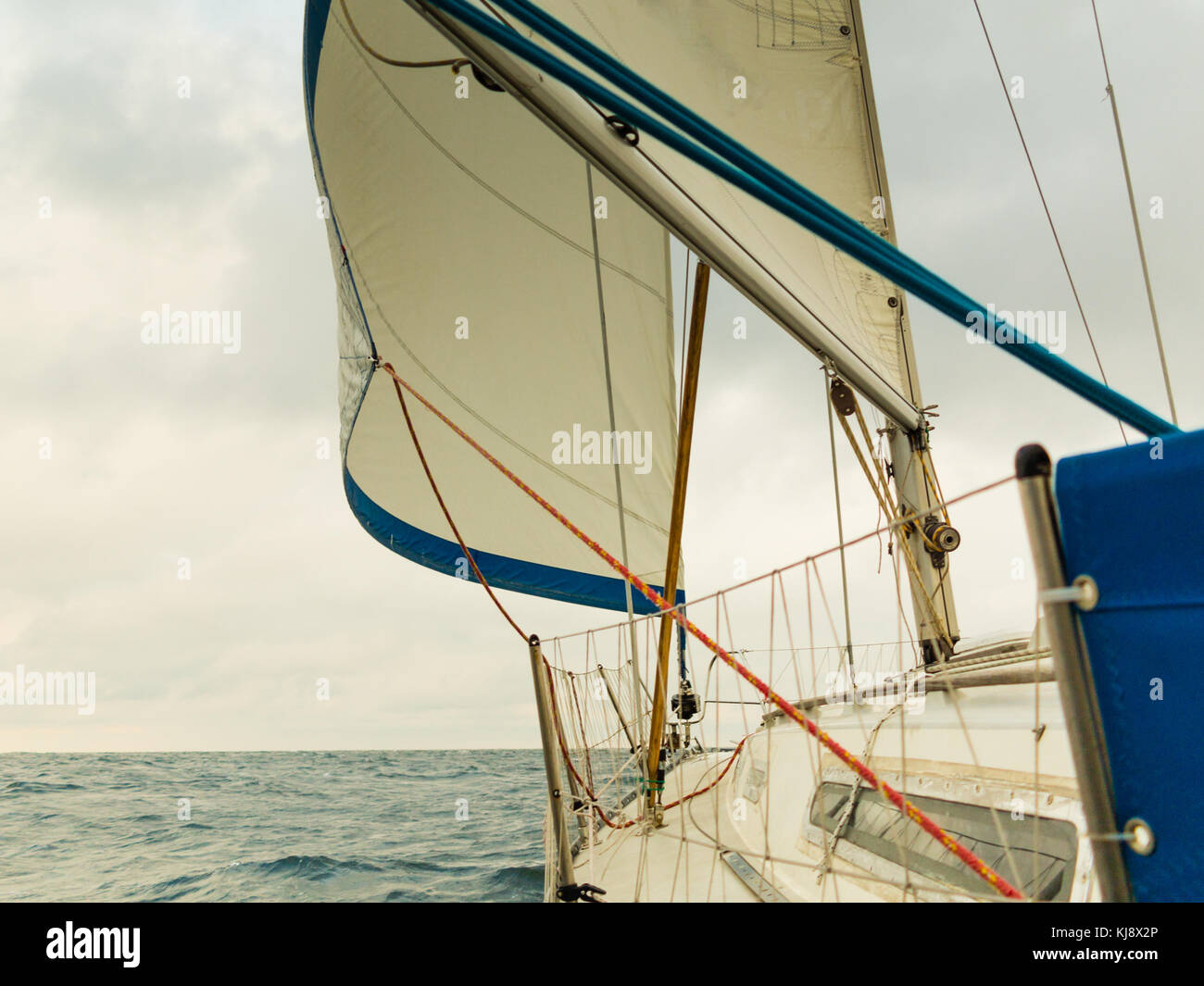Seascape before storm, dark clouds on sky, sunset weather. Sailing boat ...