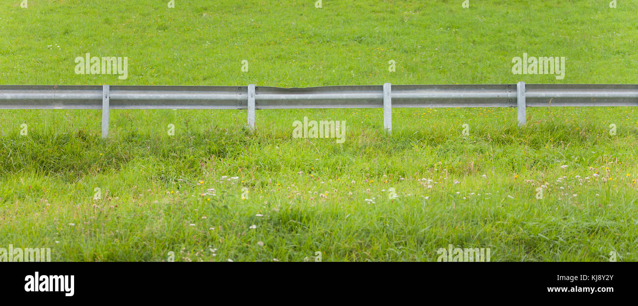 secondary road guardrail in a mountain pasture Stock Photo - Alamy