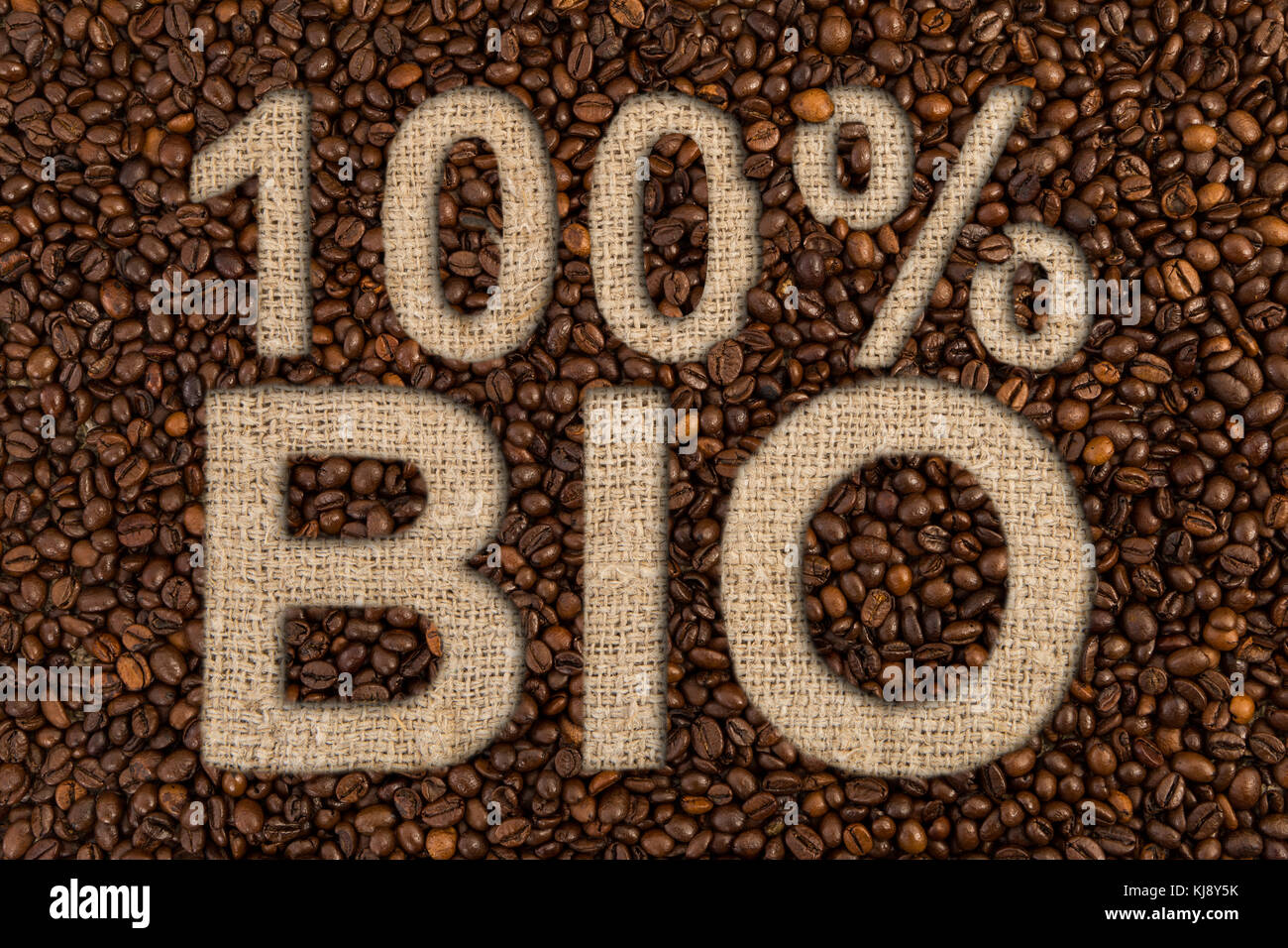 One hundred procent bio coffee concept with roasted beans and text on ...