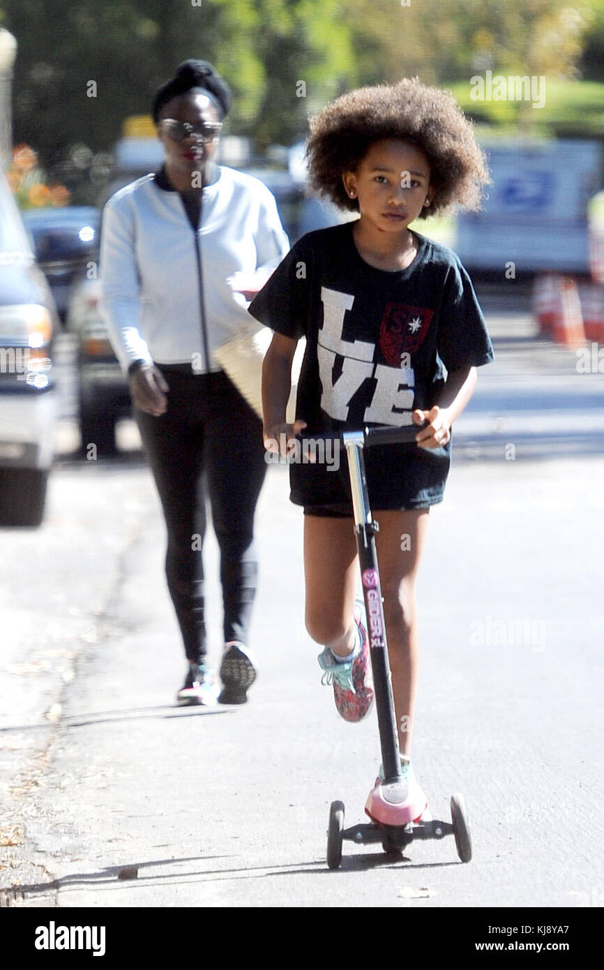 Viola Davis takes a stroll with her daughter Genesis, who is riding a ...
