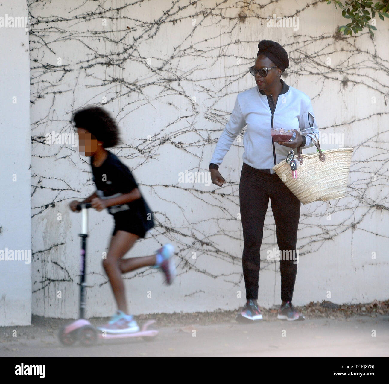 Viola Davis takes a stroll with her daughter Genesis, who is riding a ...