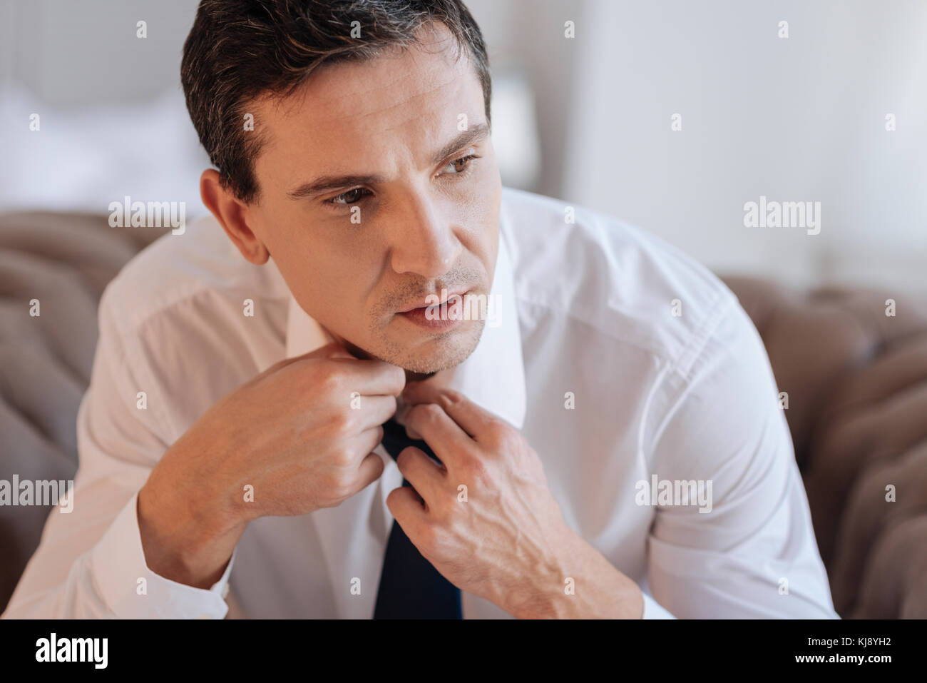 Calm smart man sitting hi-res stock photography and images - Alamy