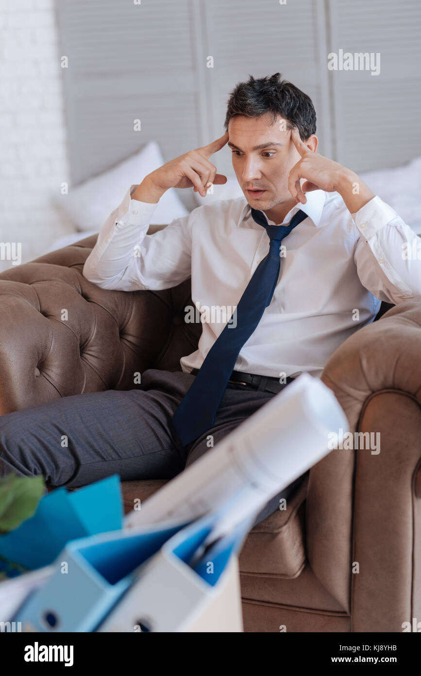Exhausted nervous man going crazy after losing his job Stock Photo - Alamy
