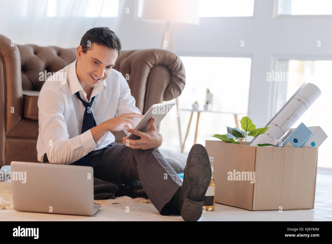 Smiling young man getting a new job very quickly Stock Photo - Alamy