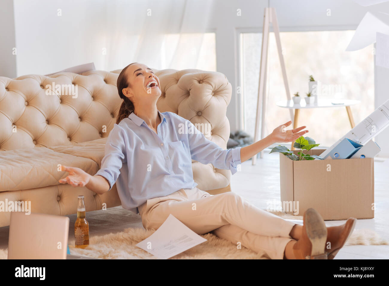 Emotional young woman looking excited while being at home Stock Photo ...