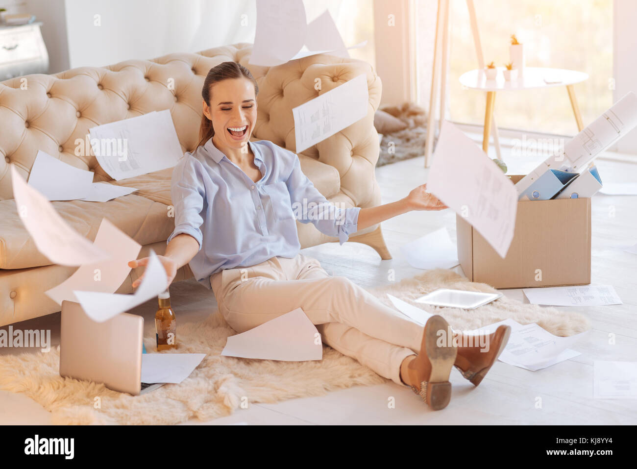 Emotional young woman celebrating her promotion at work Stock Photo - Alamy