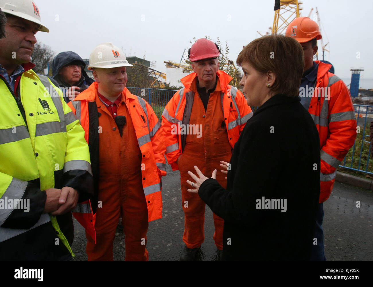 First Minister Nicola Sturgeon chats to workers at a viewing platform ...