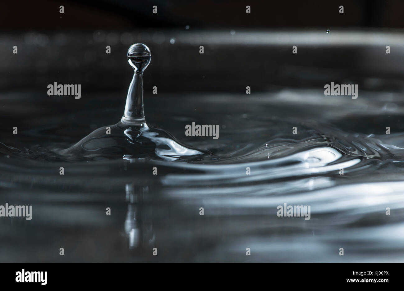 Water drop. Water splash in dark Stock Photo - Alamy