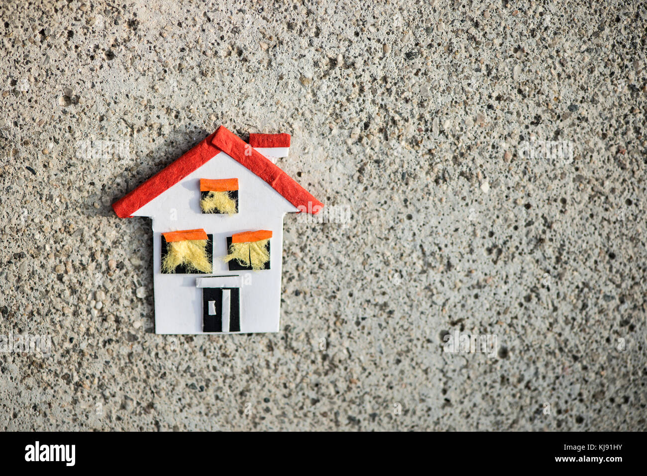House miniature and concrete wall. Paper house Stock Photo - Alamy