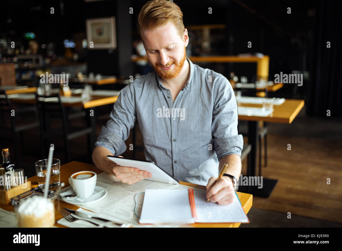 Businessman taking notes Stock Photo - Alamy