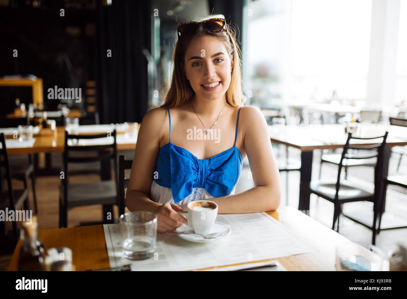 Stunning woman enjoying her coffee Stock Photo - Alamy