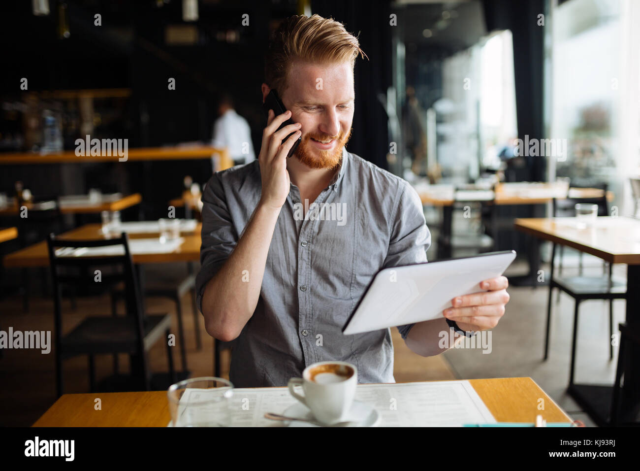 Businessman constantly working Stock Photo - Alamy