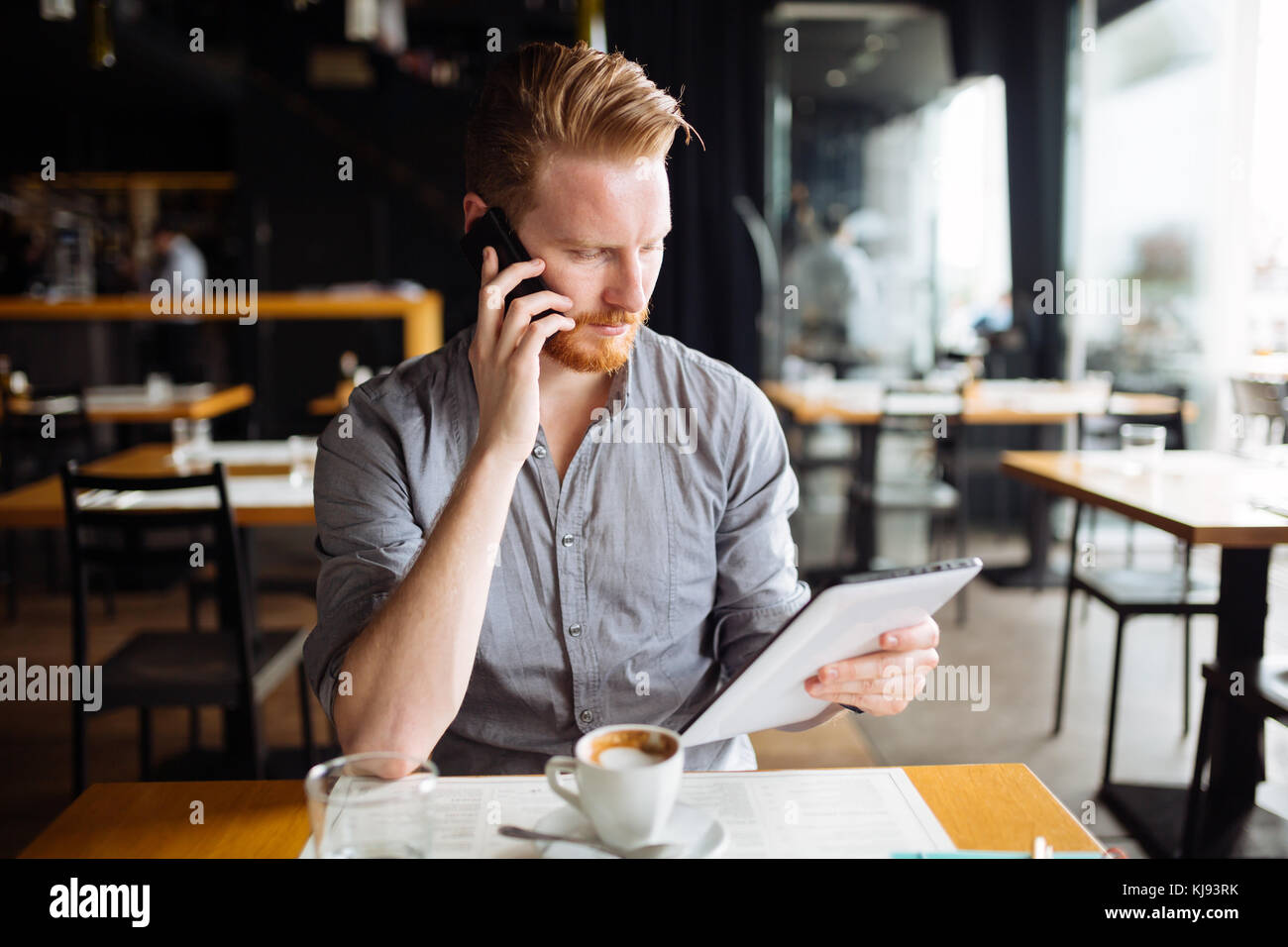 Workaholic businessman on break Stock Photo - Alamy