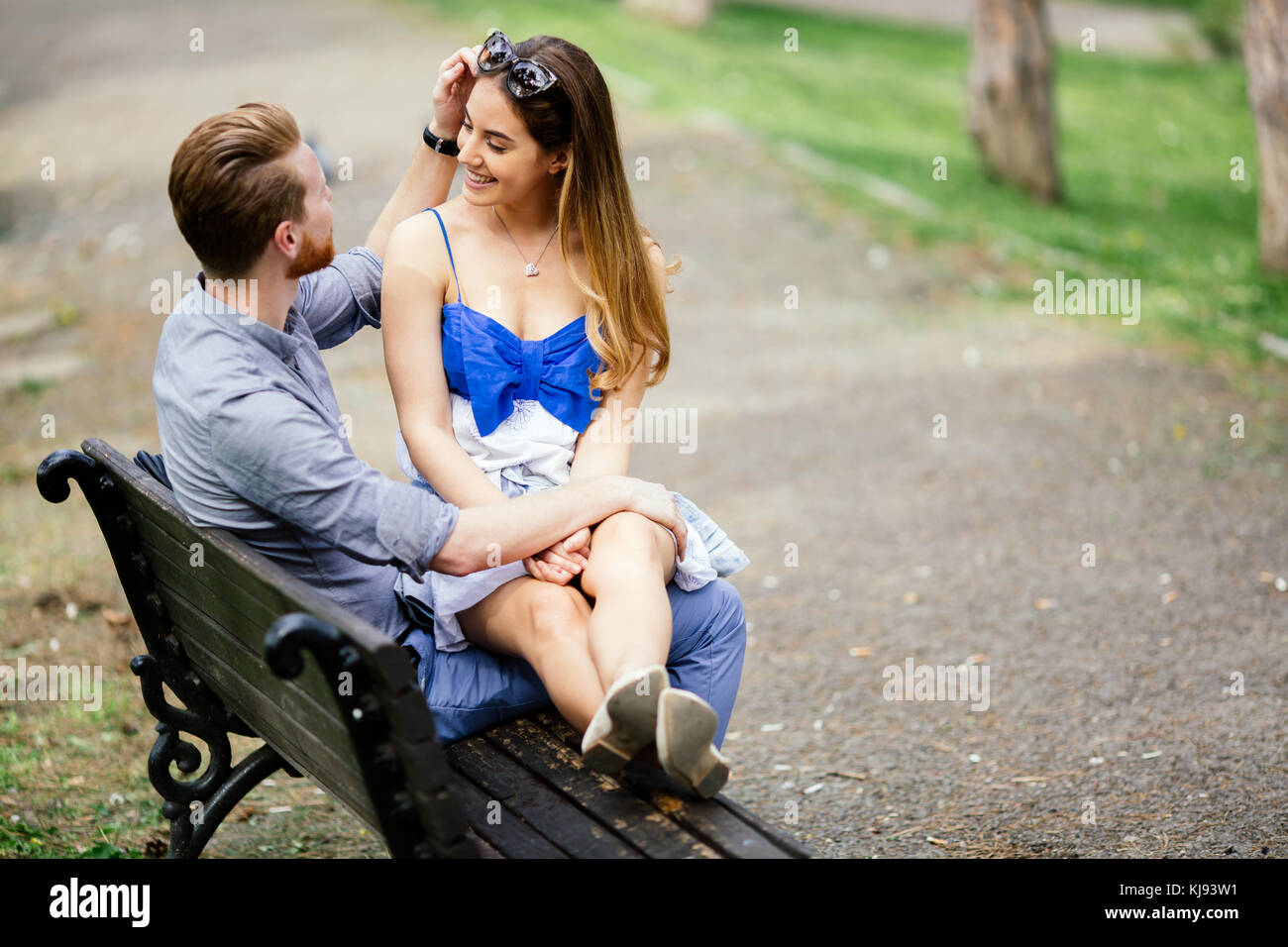 Romantic couple in park Stock Photo - Alamy