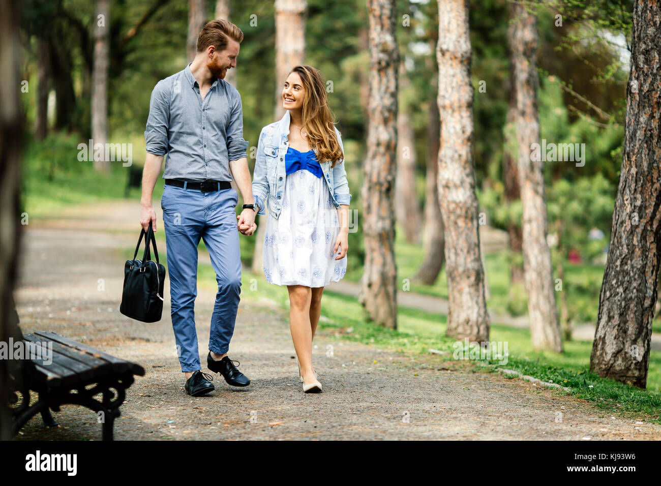 Beautiful couple taking a walk in nature Stock Photo - Alamy